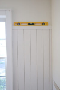 DIY Vertical Shiplap Half Wall with Real Shiplap - Angela Marie Made